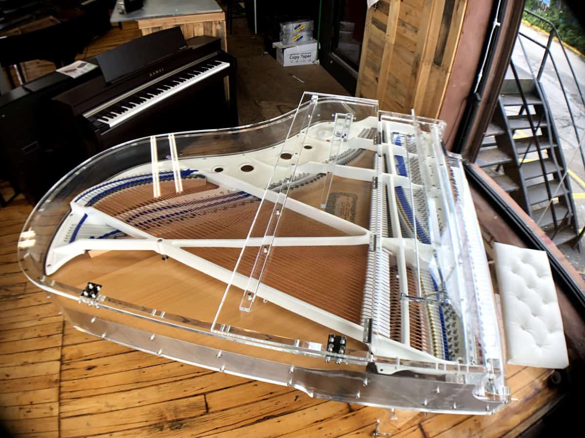 Playing A Clear Grand Piano Made of Transparent Acrylic