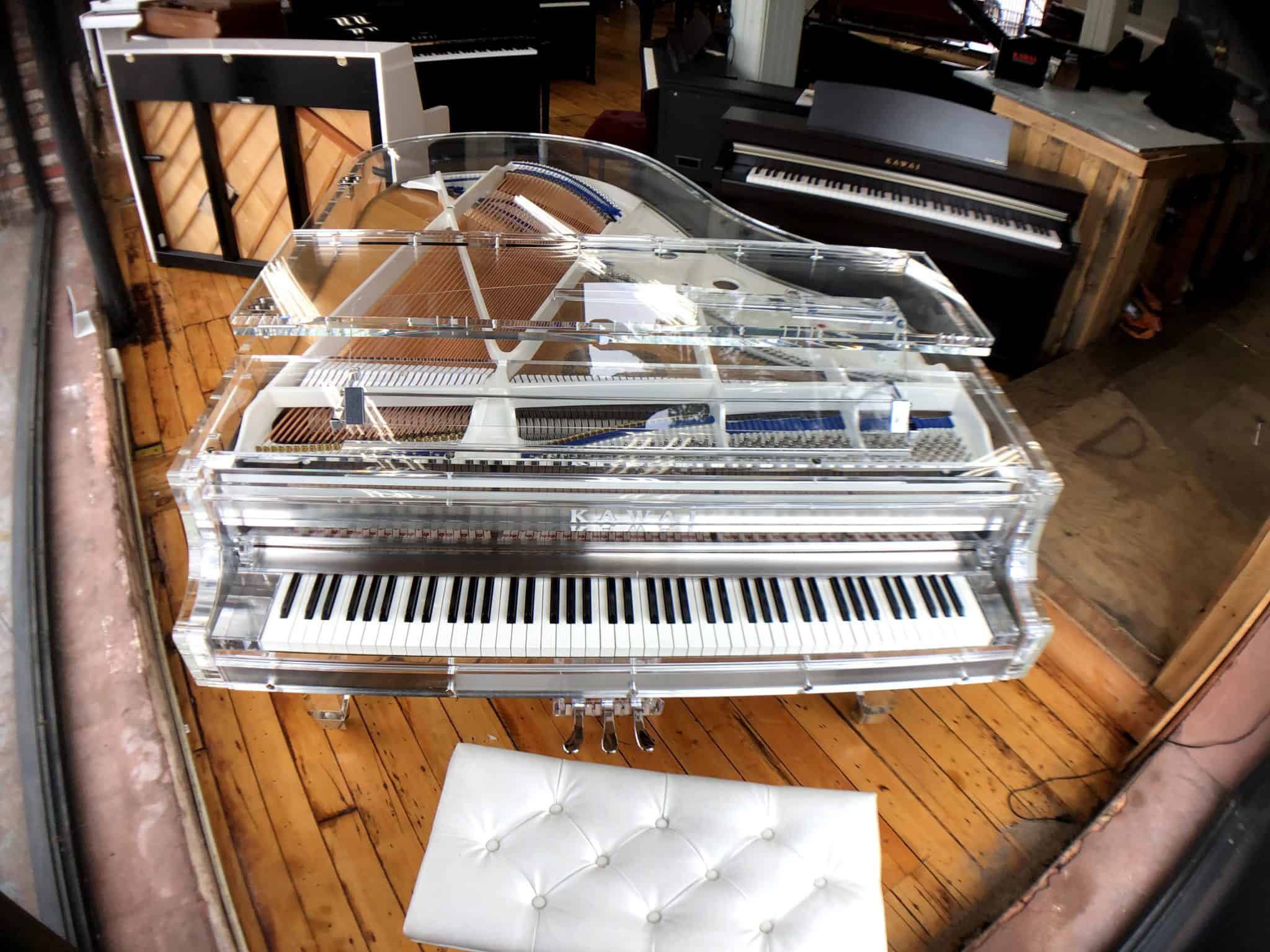 Playing A Clear Grand Piano Made of Transparent Acrylic