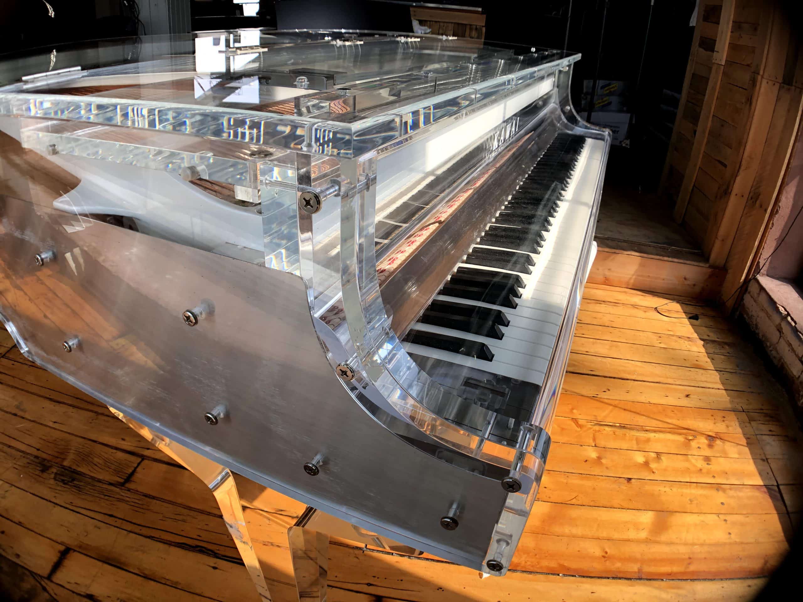Playing A Clear Grand Piano Made of Transparent Acrylic