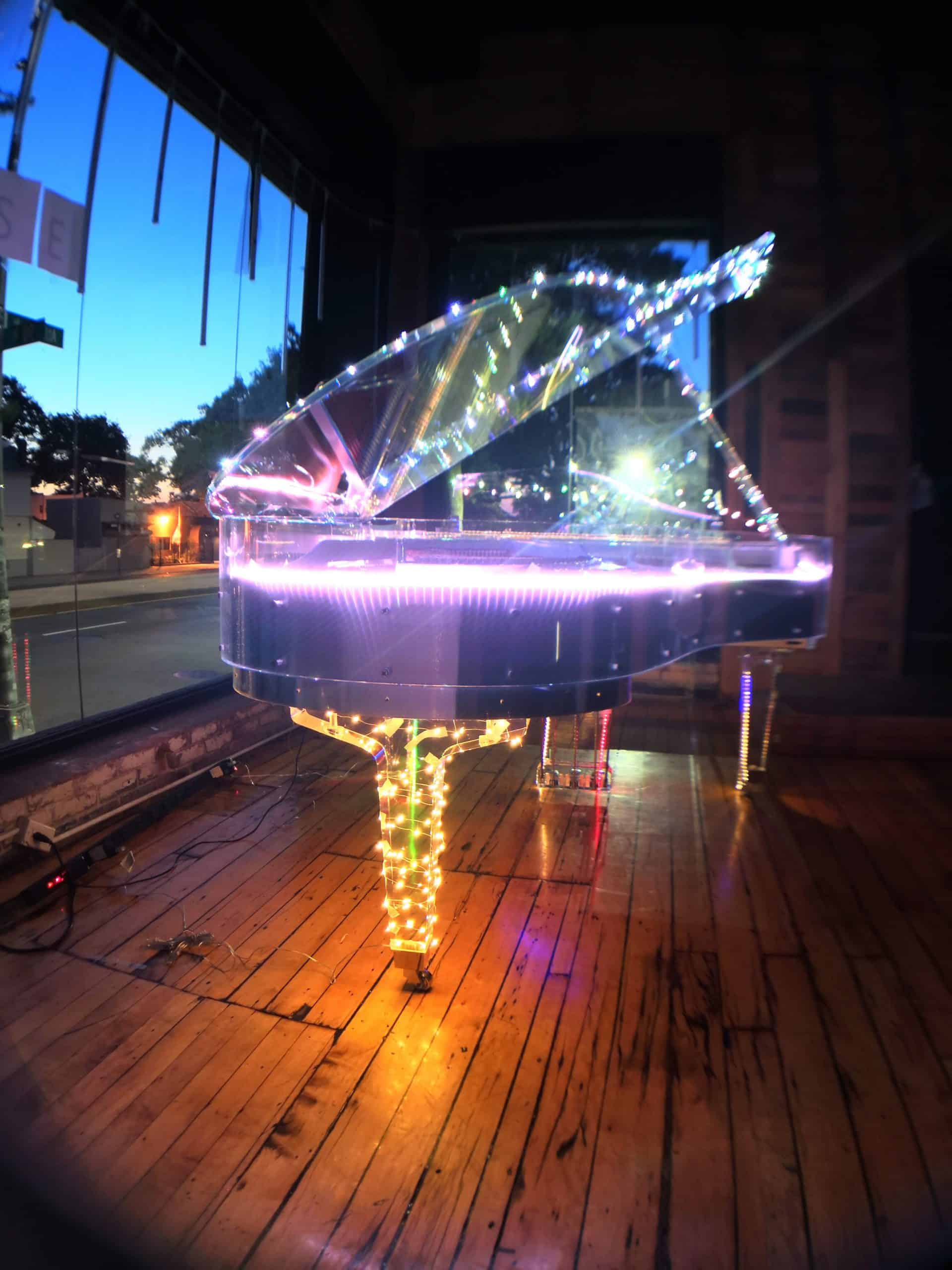 Playing A Clear Grand Piano Made of Transparent Acrylic