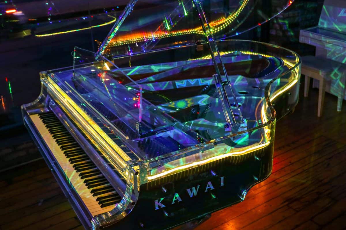 Playing A Clear Grand Piano Made of Transparent Acrylic