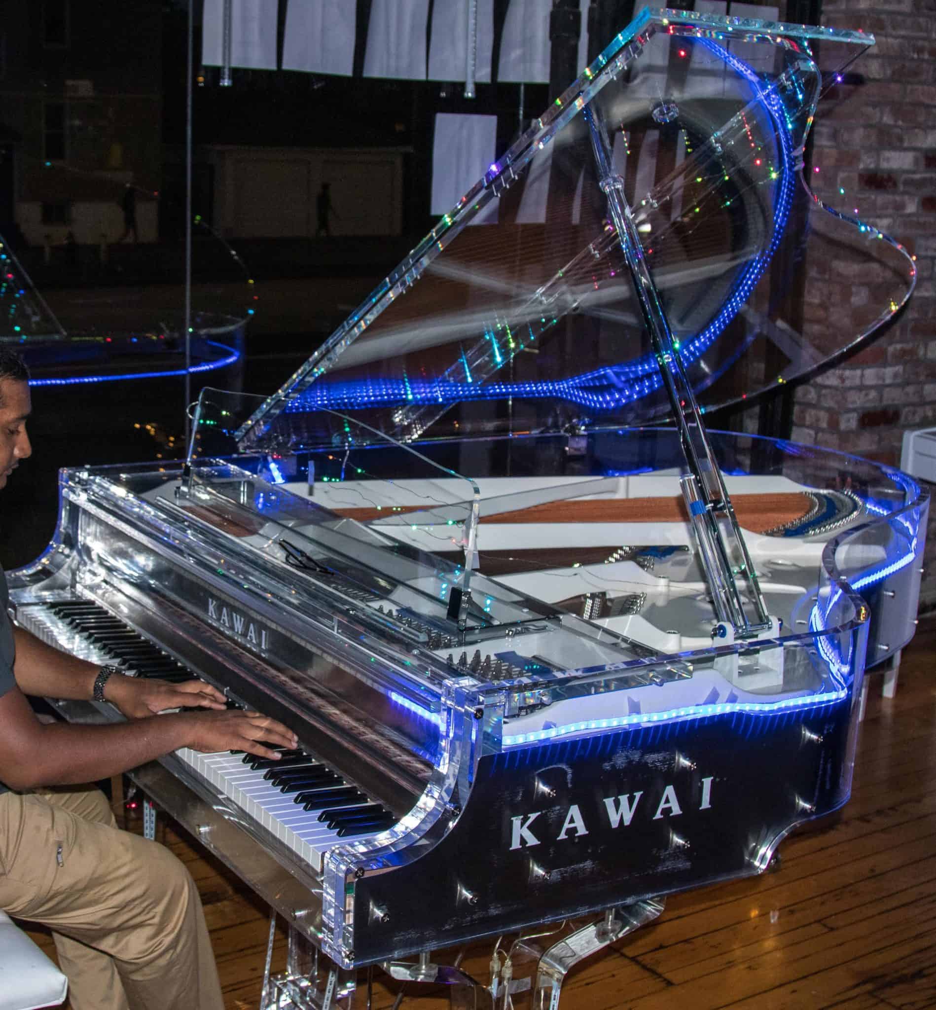 Playing A Clear Grand Piano Made of Transparent Acrylic