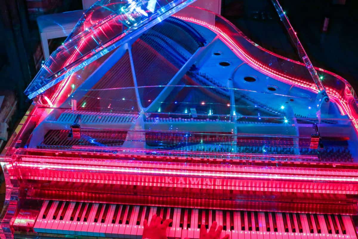 Playing A Clear Grand Piano Made of Transparent Acrylic